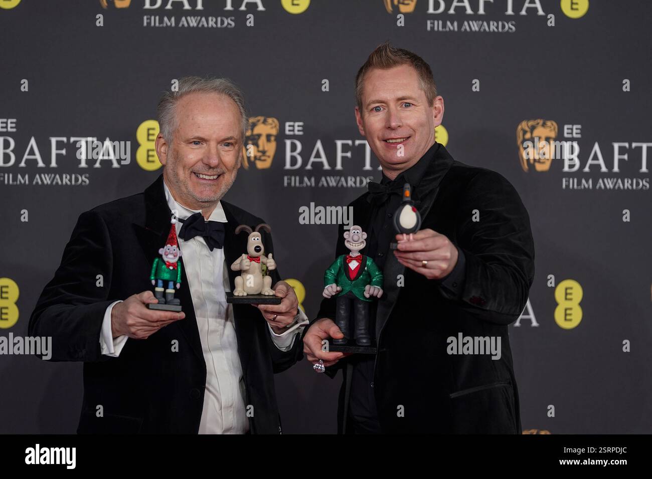Nick Park, left, and Merlin Crossingham pose for photographers upon ...