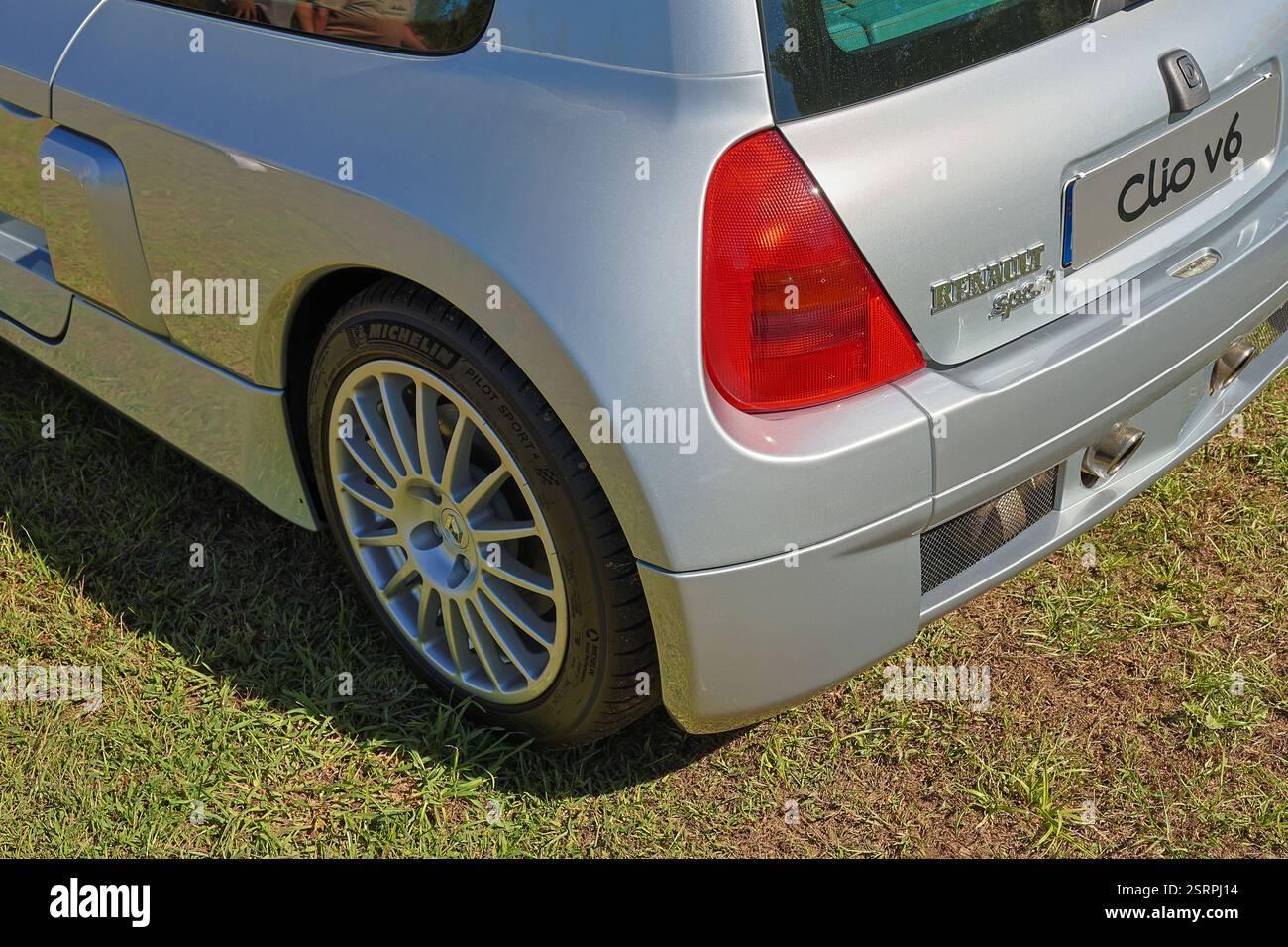 Silver renault clio v6 sport hatchback car parked on grass field ...