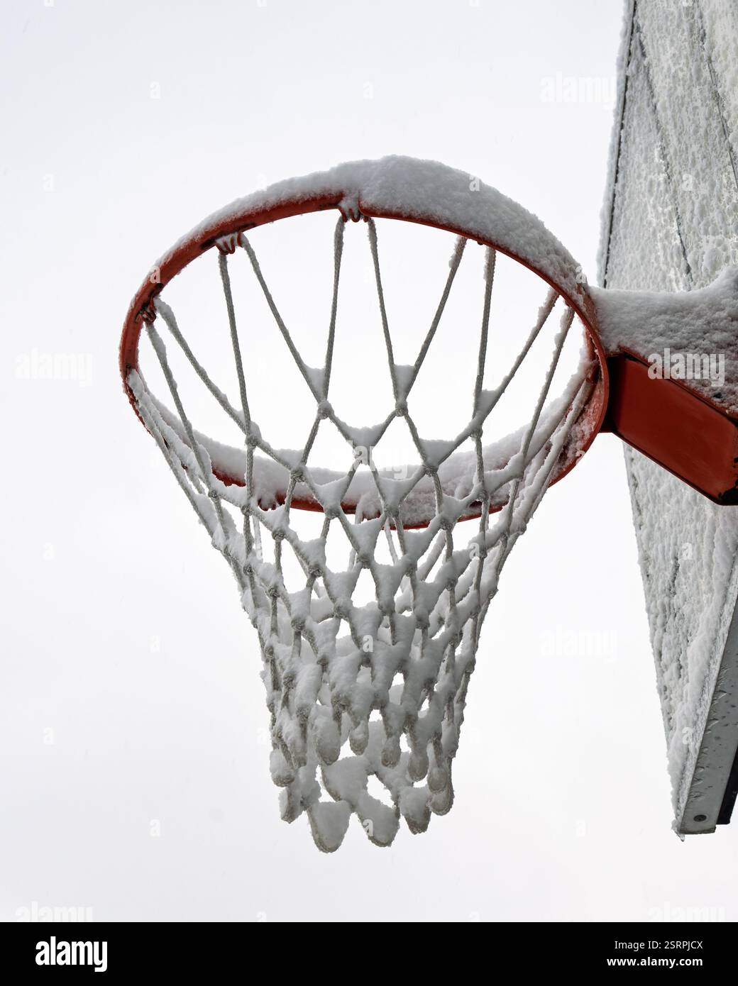Basketball goal covered in freshly fallen snow Stock Photo - Alamy