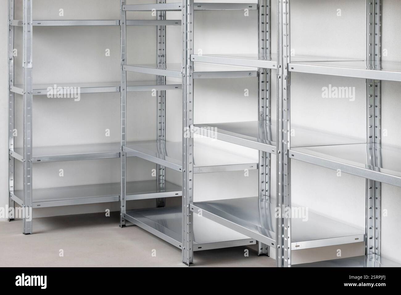 Industrial style metal shelving unit. Modern warehouse space. Empty ...