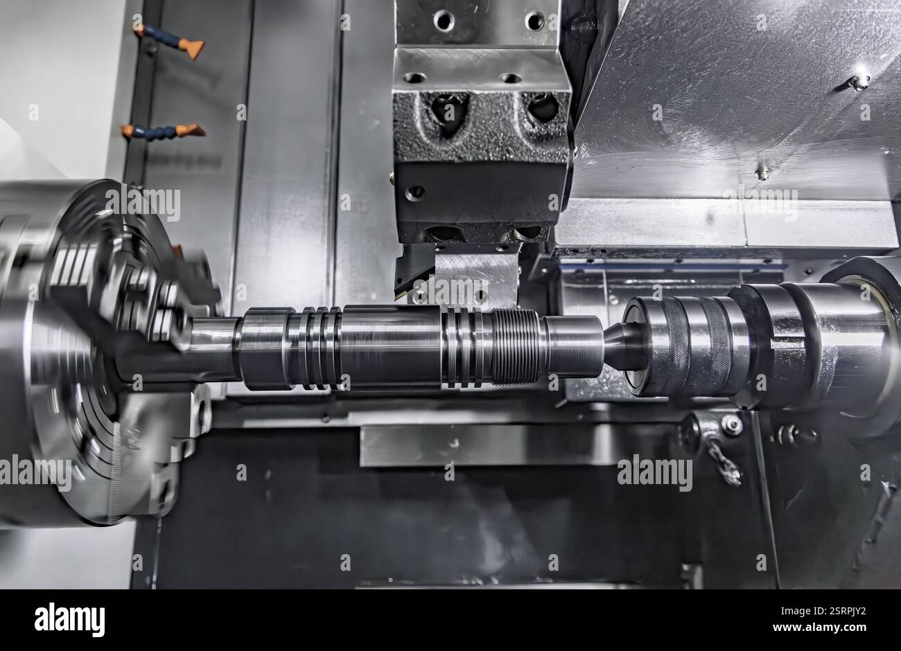 Metalworking CNC lathe milling machine. Cutting metal modern processing technology. Milling is ...