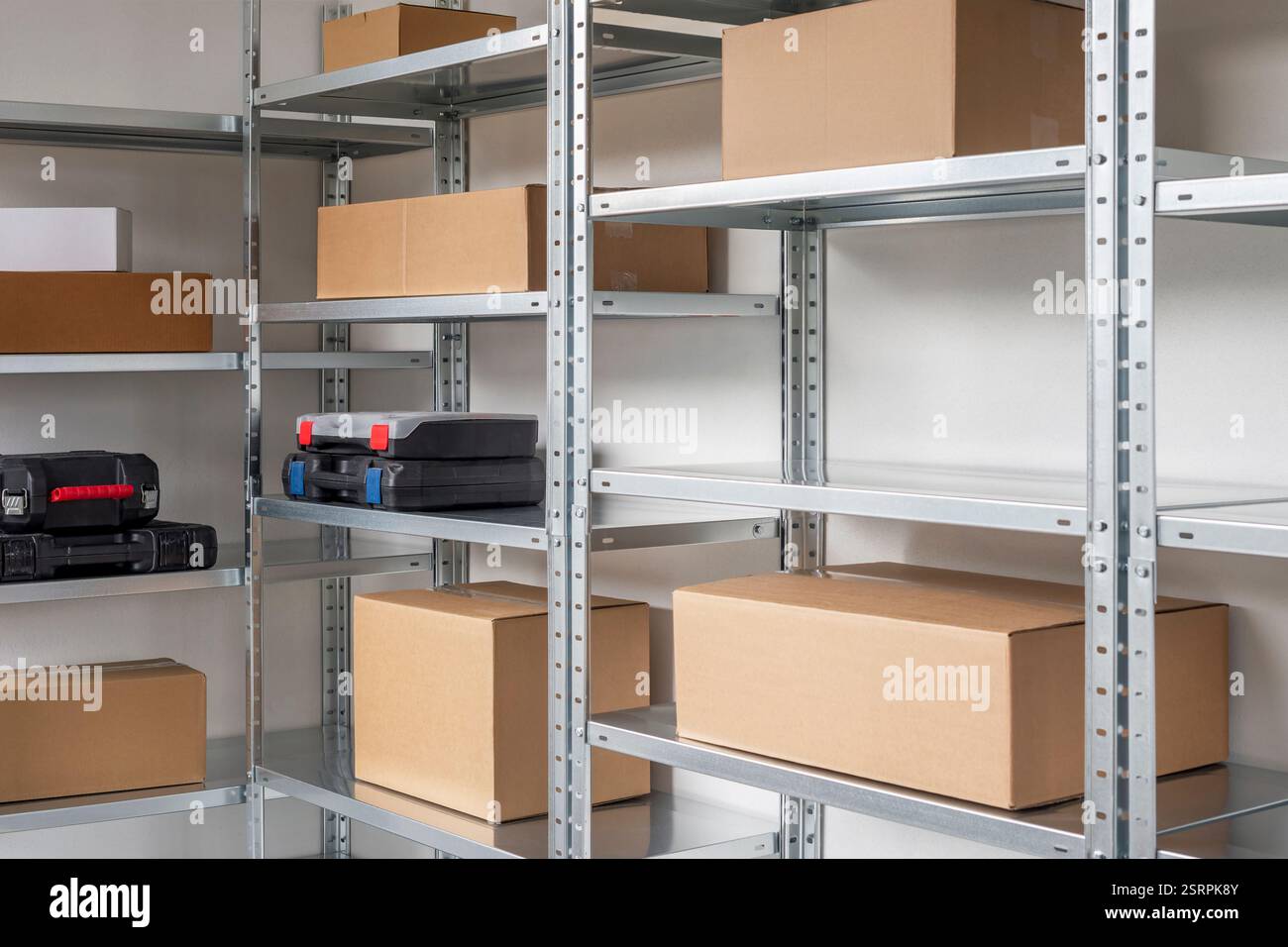 Cardboard and plastic tool boxes on silver stainless steel metal ...