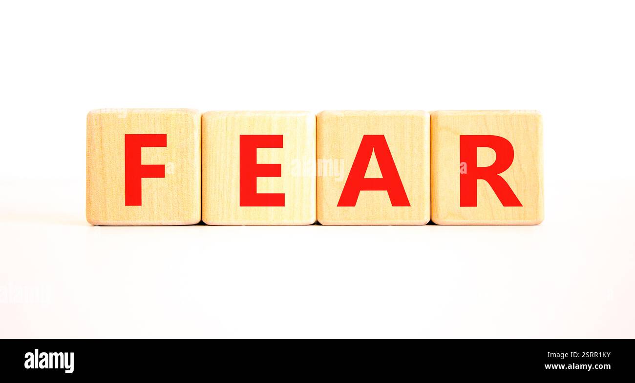 Fear symbol. Concept word Fear on beautiful wooden blocks. Beautiful ...