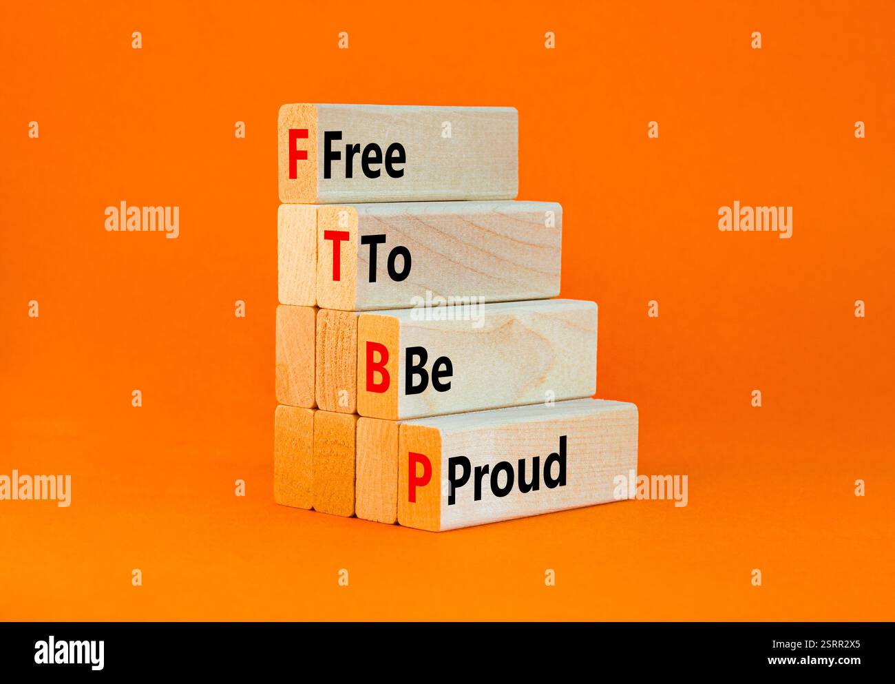 FTBP Free To Be Proud symbol. Concept word FTBP Free To Be Proud on beautiful wooden blocks ...