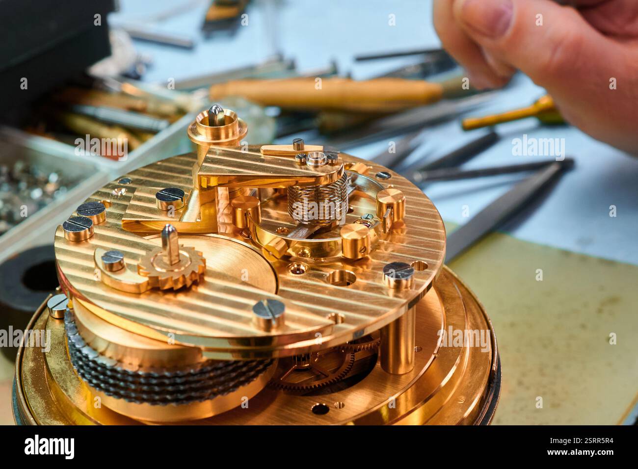 Intricate clock mechanism showcases craftsmanship during delicate ...