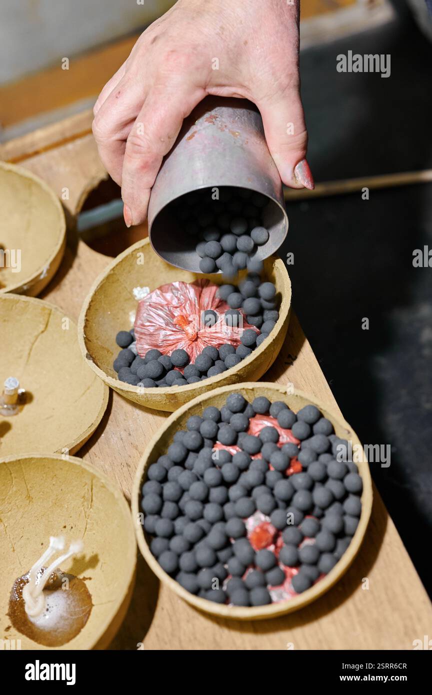 Crafting vibrant bursts of color in factory high-rise fireworks ...