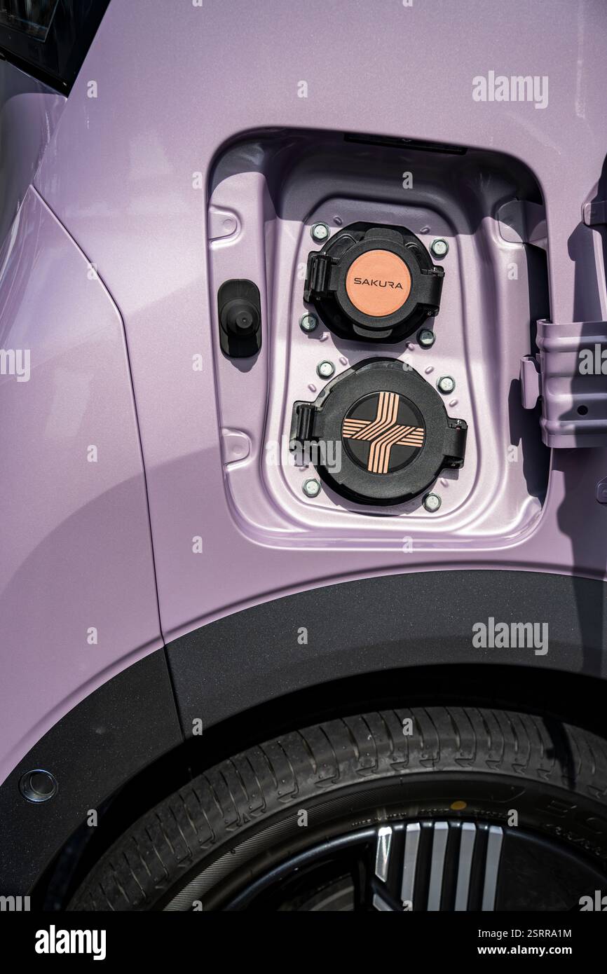 Fast and slow charging ports of a Nissan Sakura, an electric kei car ...