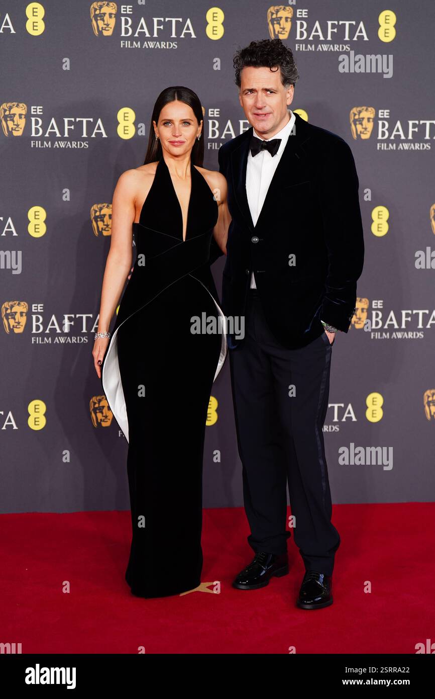 Felicity Jones and Charles Guard attending the EE Bafta Film Awards ...
