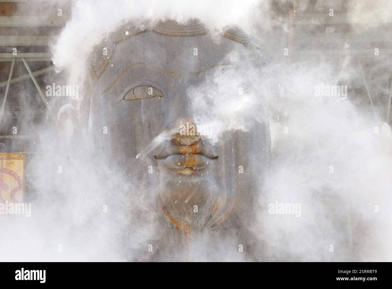Sandalwood powder sprinkled on eighteen meter high statue of bhagwan ...