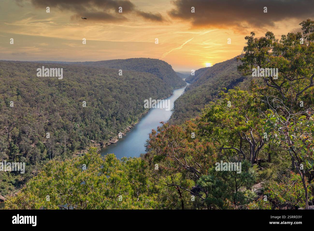 Photograph of the Nepean River under a cloudy orange sky from The Rock ...