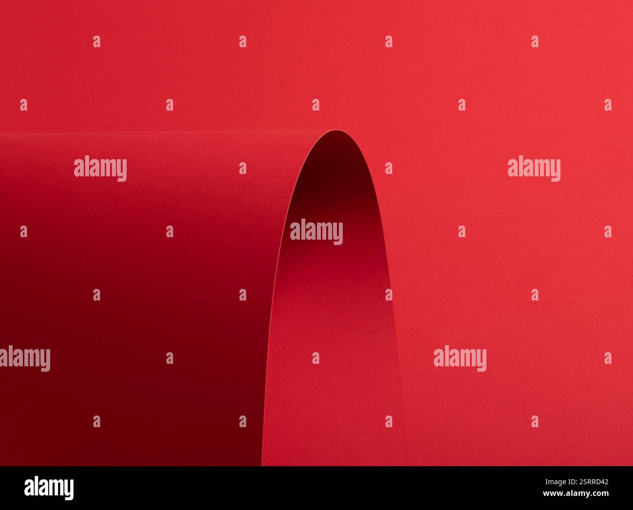 Bold scarlet red paper background with a deep matte texture and ...