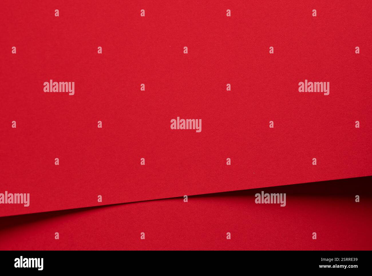 Bold scarlet red paper background with a deep matte texture and ...
