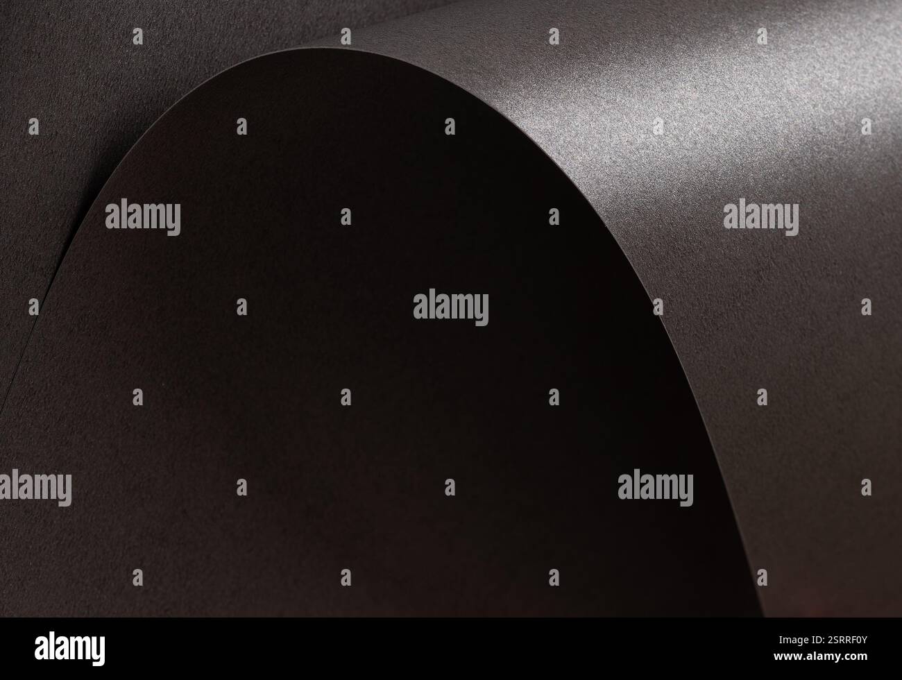 Charcoal gray paper background with a pearlescent, glossy texture. Deep ...