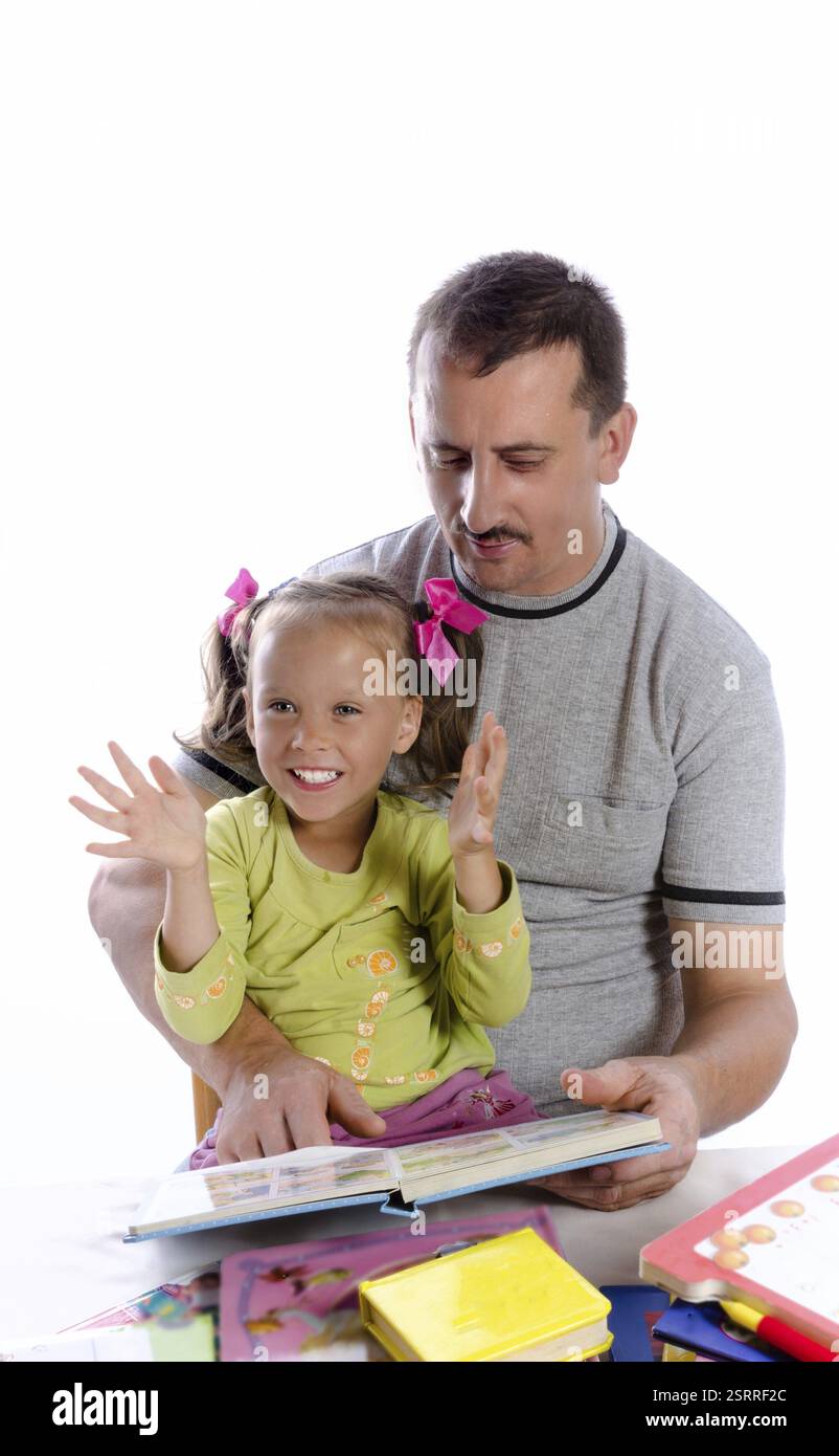 Father reading daughters book hi-res stock photography and images - Alamy