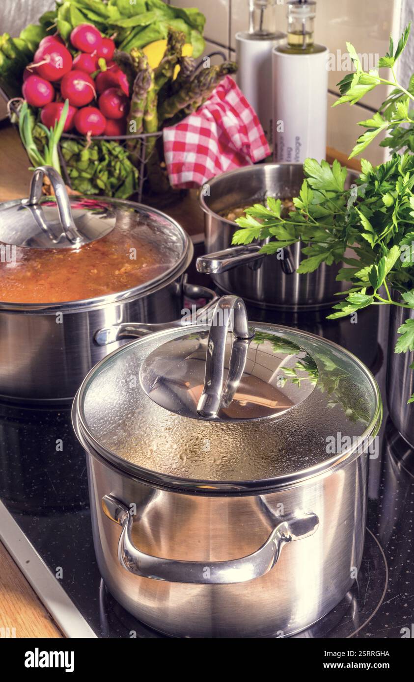 Cooking pots on the stove Stock Photo - Alamy