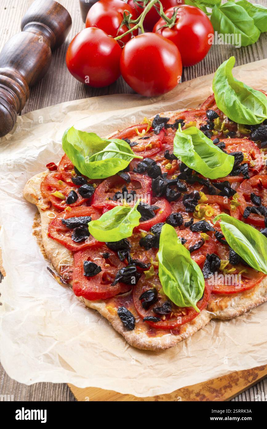 Homemade olive - tomato pizza Stock Photo - Alamy
