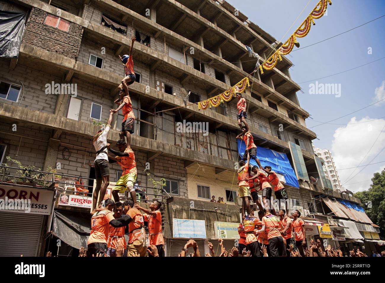 Men human pyramid breaking Dahi Handi, Janmashtami festival, Mumbai ...