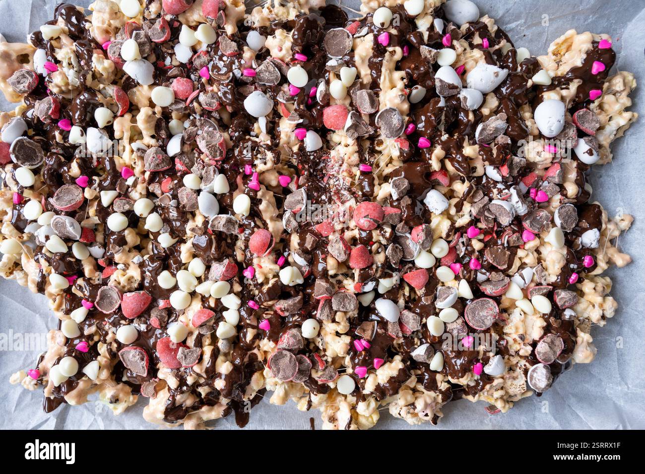 An irresistible mix of popcorn coated in melted dark chocolate, gooey ...
