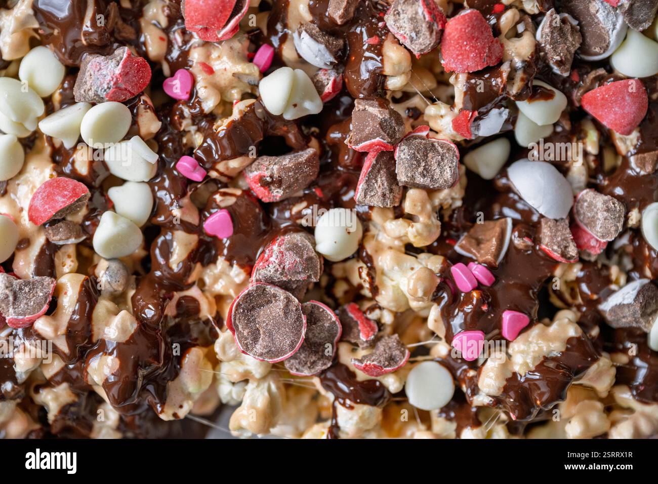 An irresistible mix of popcorn coated in melted dark chocolate, gooey ...