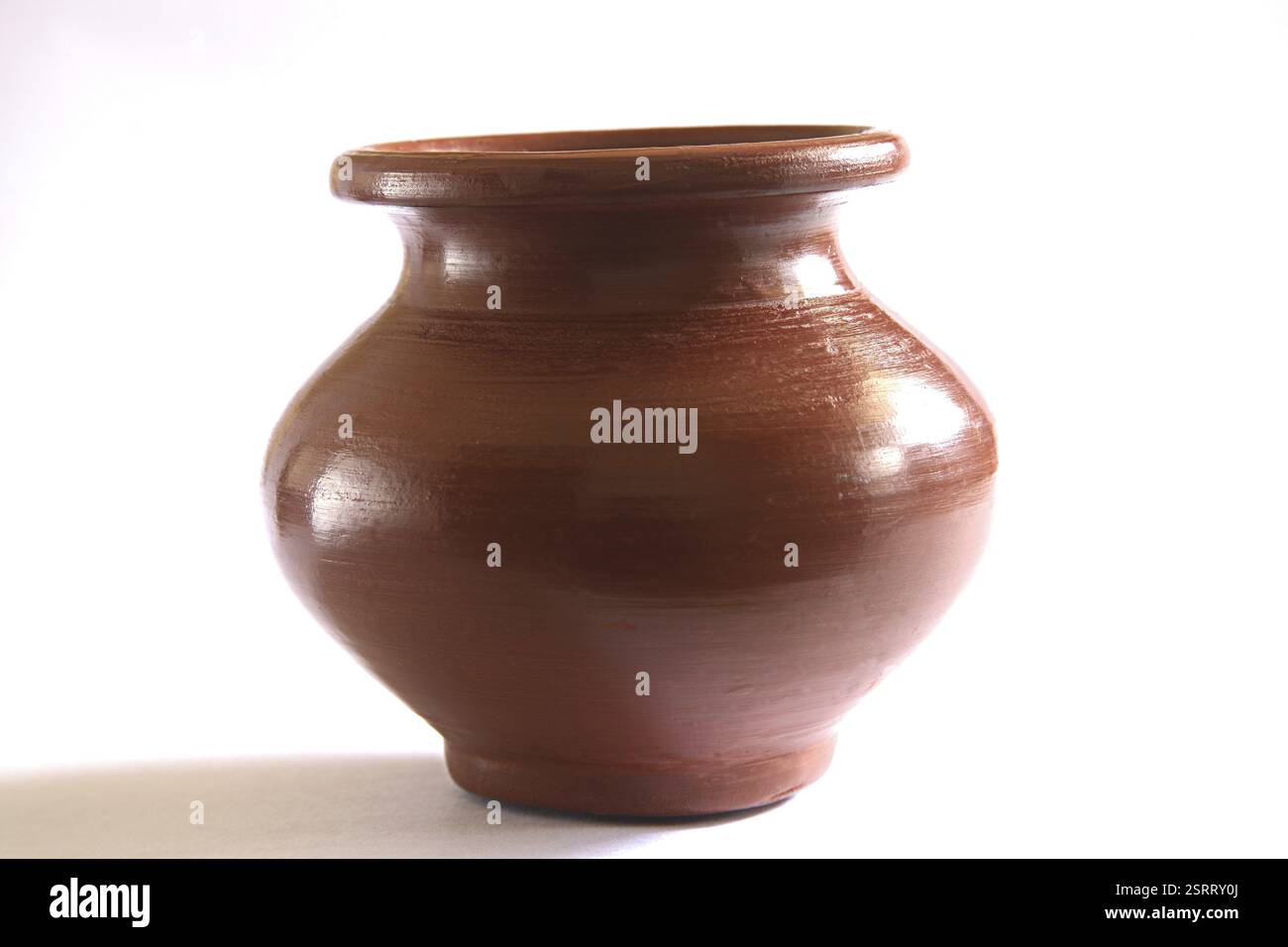 Concept, ghada clay or earthen pot crock pail pitcher on white ...