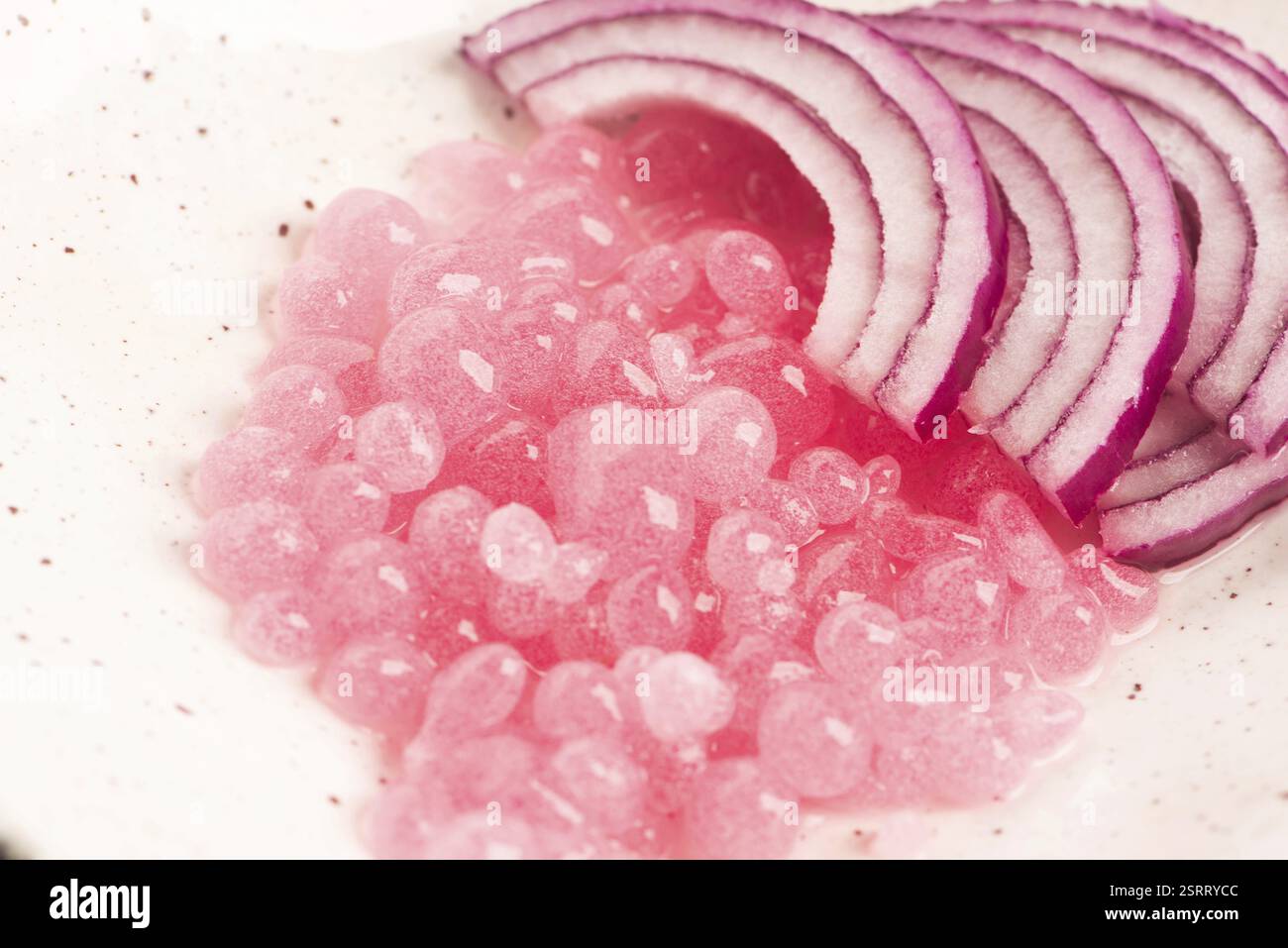 Molecular onion caviar balls on ceramics plate Stock Photo - Alamy