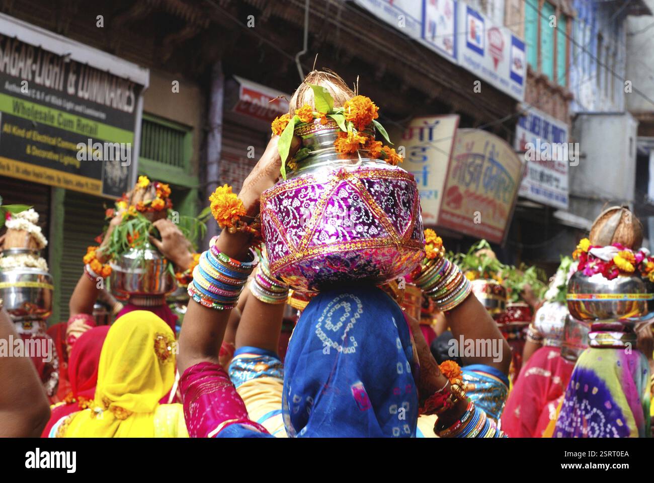 Decorated kalash on head of woman in mangal kalash yatra, Jodhpur ...