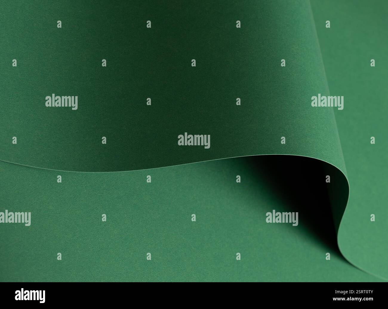 Deep emerald green paper background with a smooth texture and elegant ...