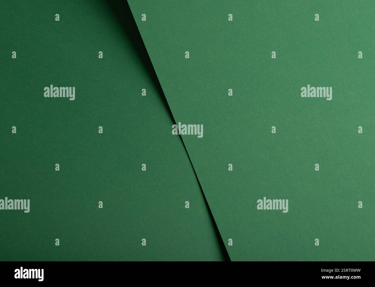 Deep emerald green paper background with a smooth texture and subtle ...