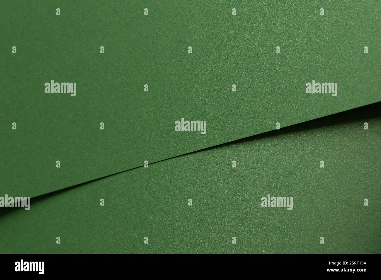 Deep forest green paper background with a smooth matte texture and ...