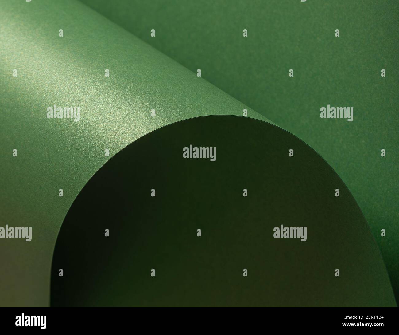 Deep green paper background with a smooth matte texture and subtle wavy ...