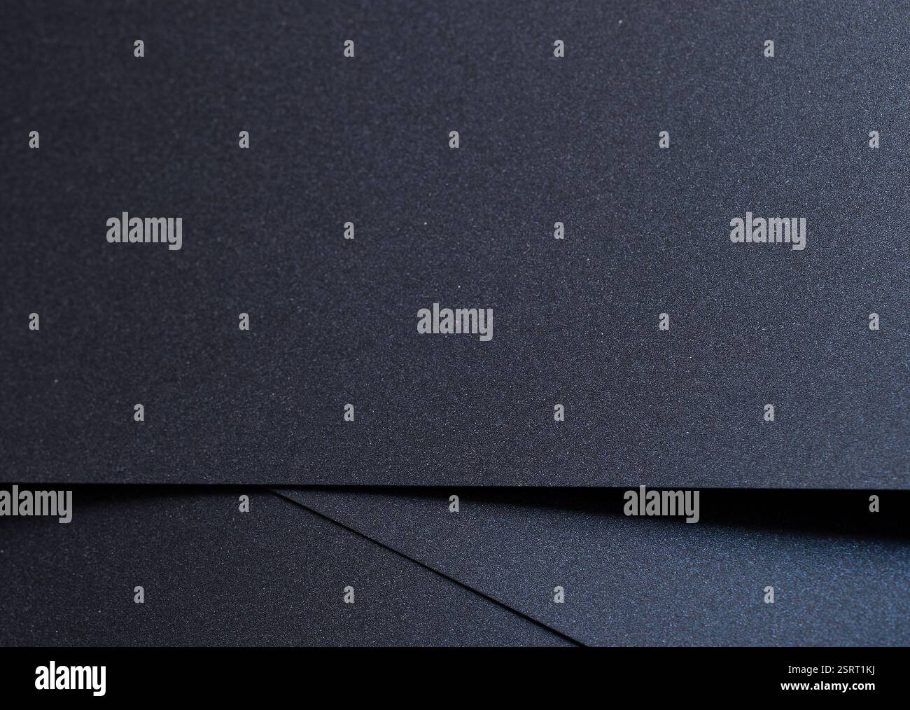 Deep navy blue paper background with a smooth matte texture and subtle ...