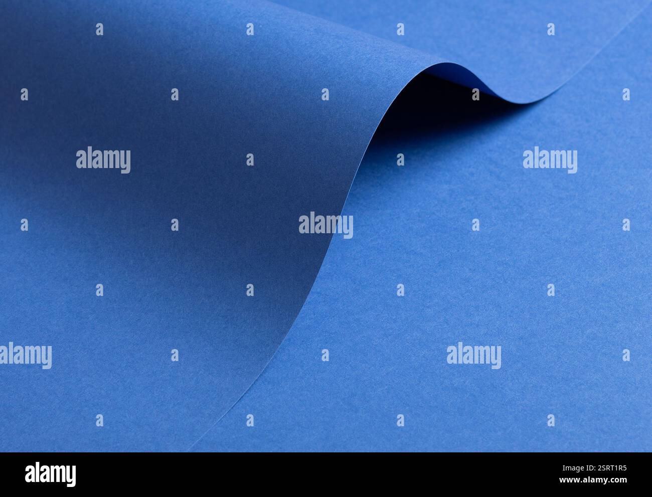 Deep sapphire blue paper background with a smooth texture and ...