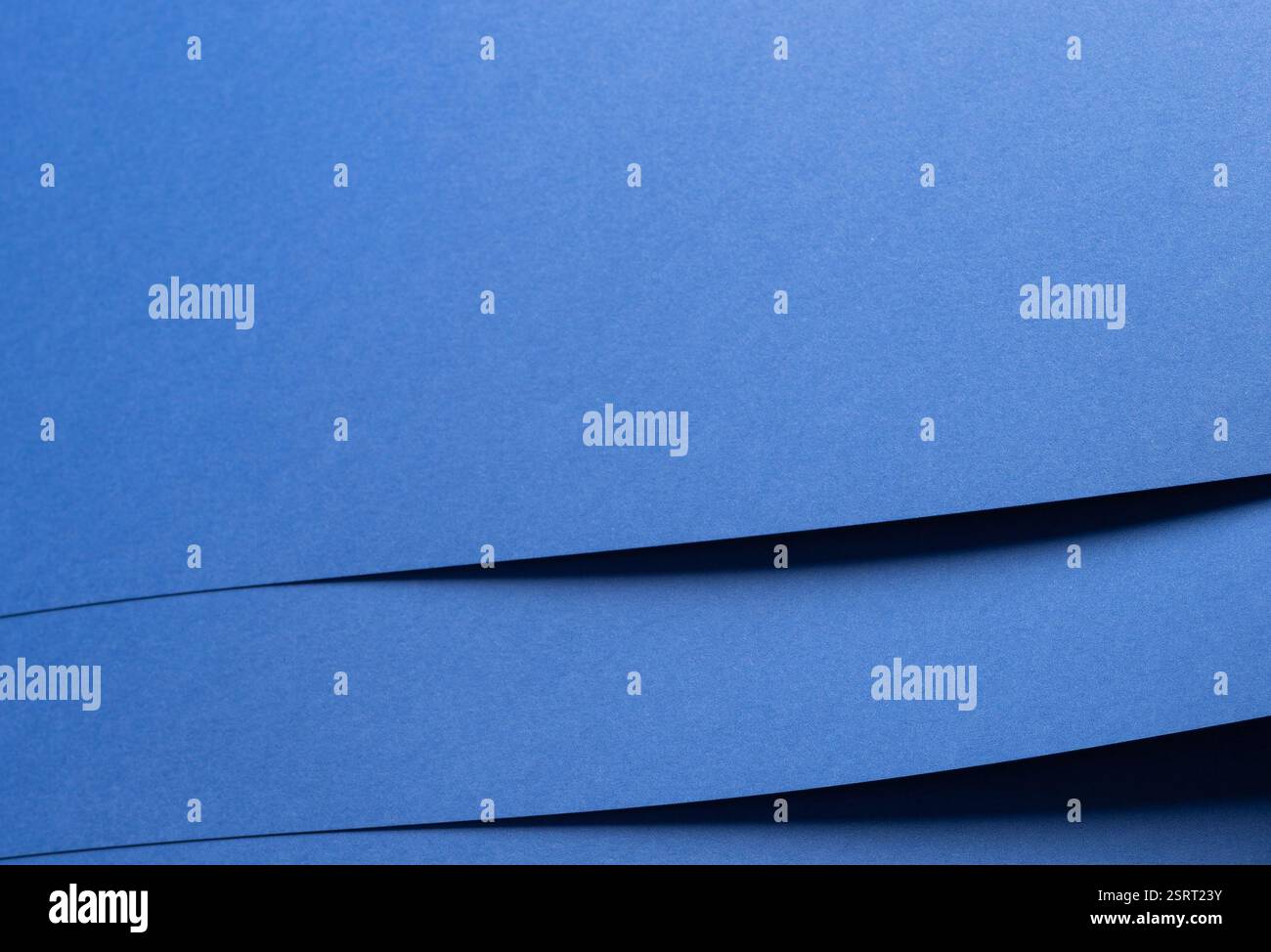 Deep sapphire blue paper background with smooth texture and overlapping ...
