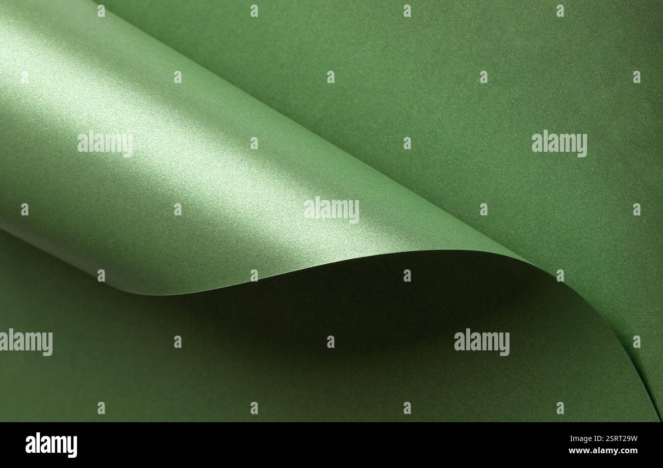 Emerald green paper background with a pearlescent, glossy texture and ...