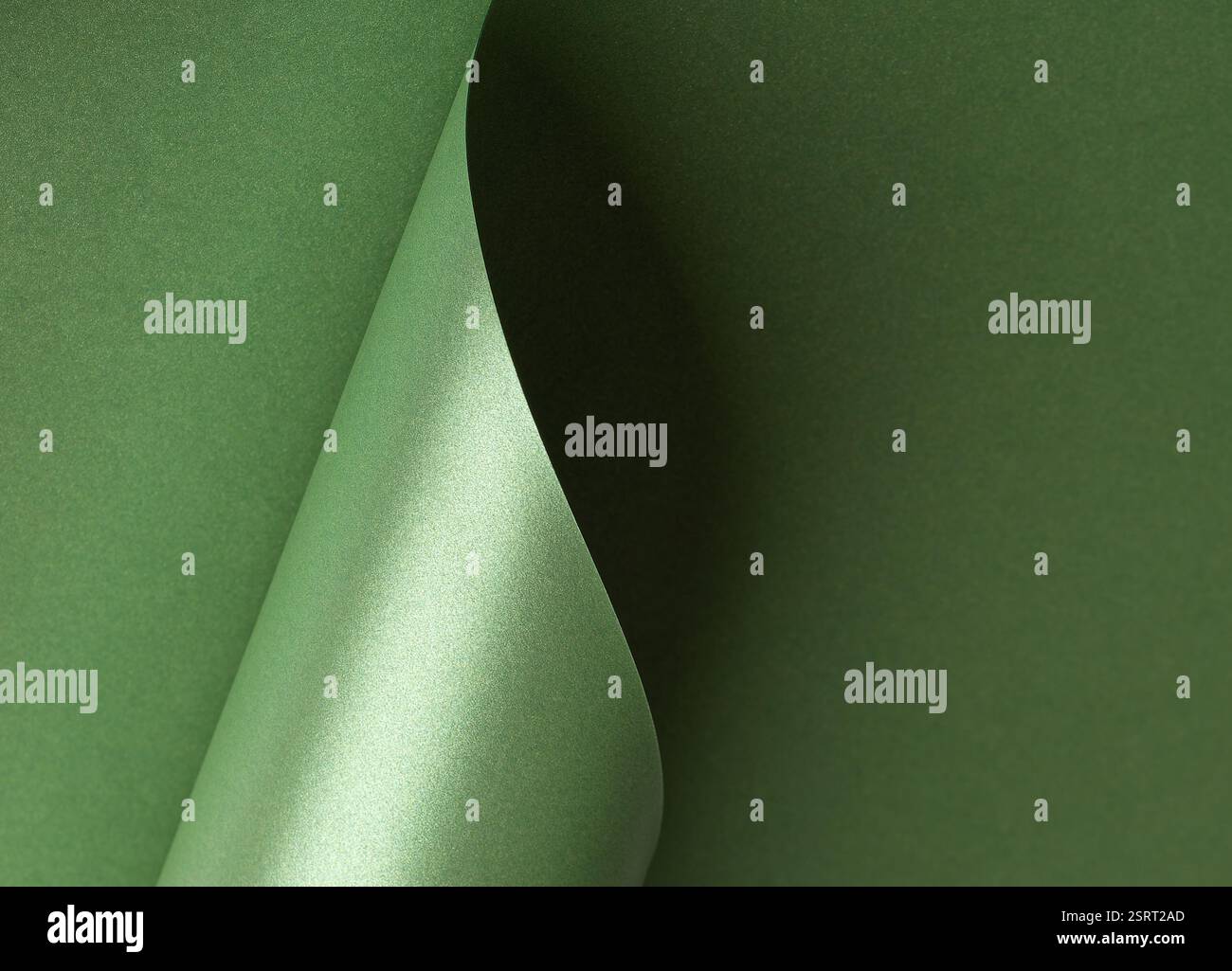 Emerald green paper background with a pearlescent, shimmering wavy ...