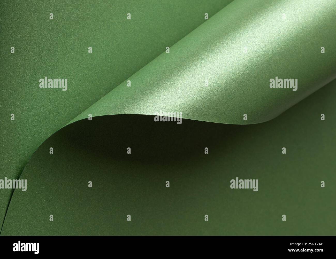 Emerald green paper background with a pearlescent, glossy texture and ...