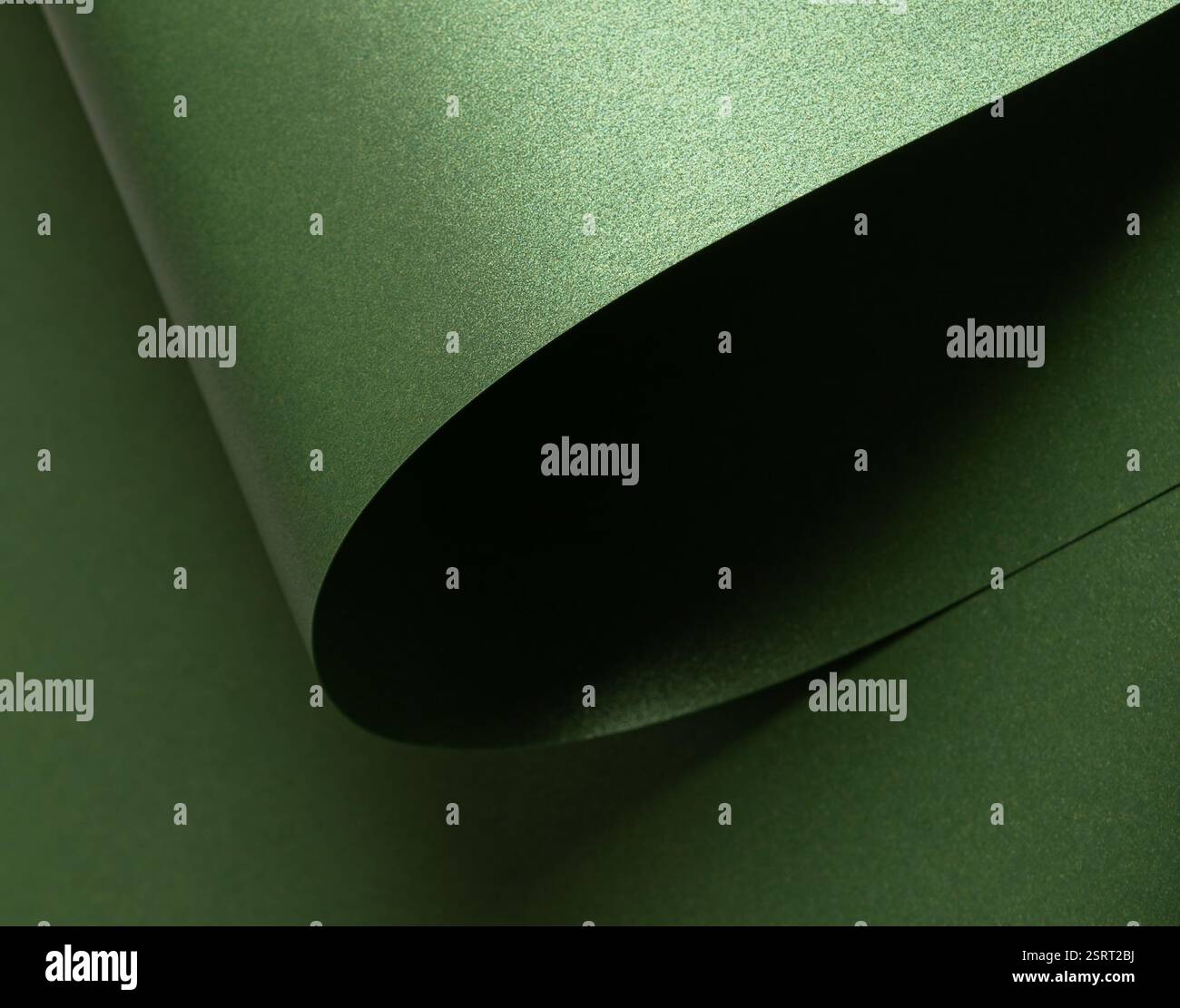 Emerald green paper background with a pearlescent, glossy texture and ...