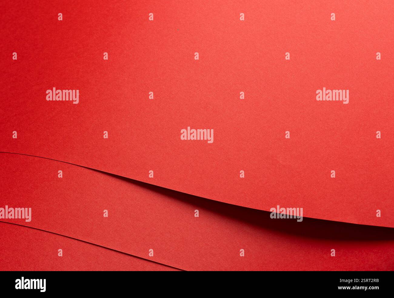 Fiery coral red paper background with a smooth texture and overlapping ...