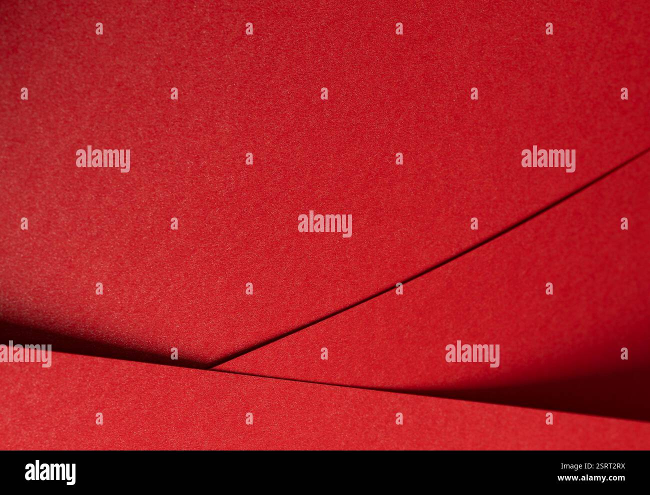 Fiery crimson paper background with a fine textured surface and layered ...