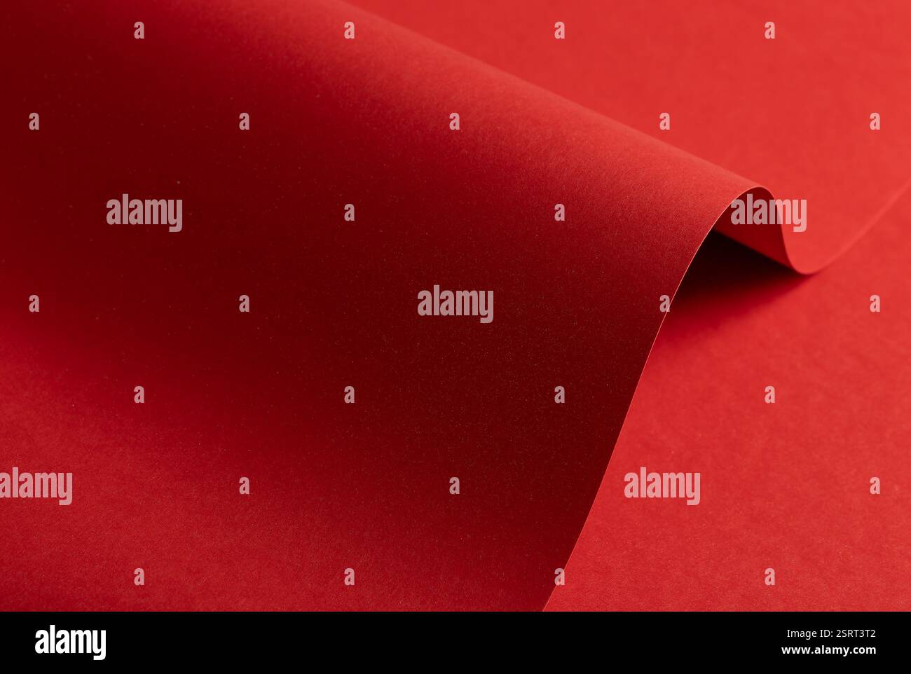 Fiery crimson paper background with a smooth texture and wavy edges ...