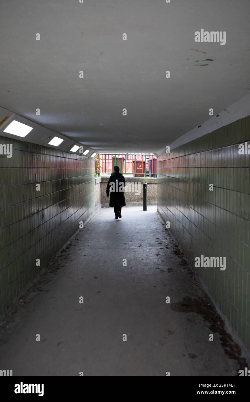 Woman in scary underpass Stock Photo - Alamy