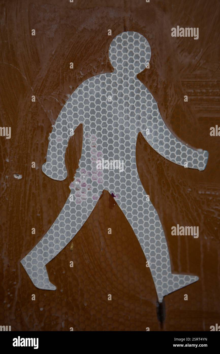 Man figure from a street-sign Stock Photo - Alamy
