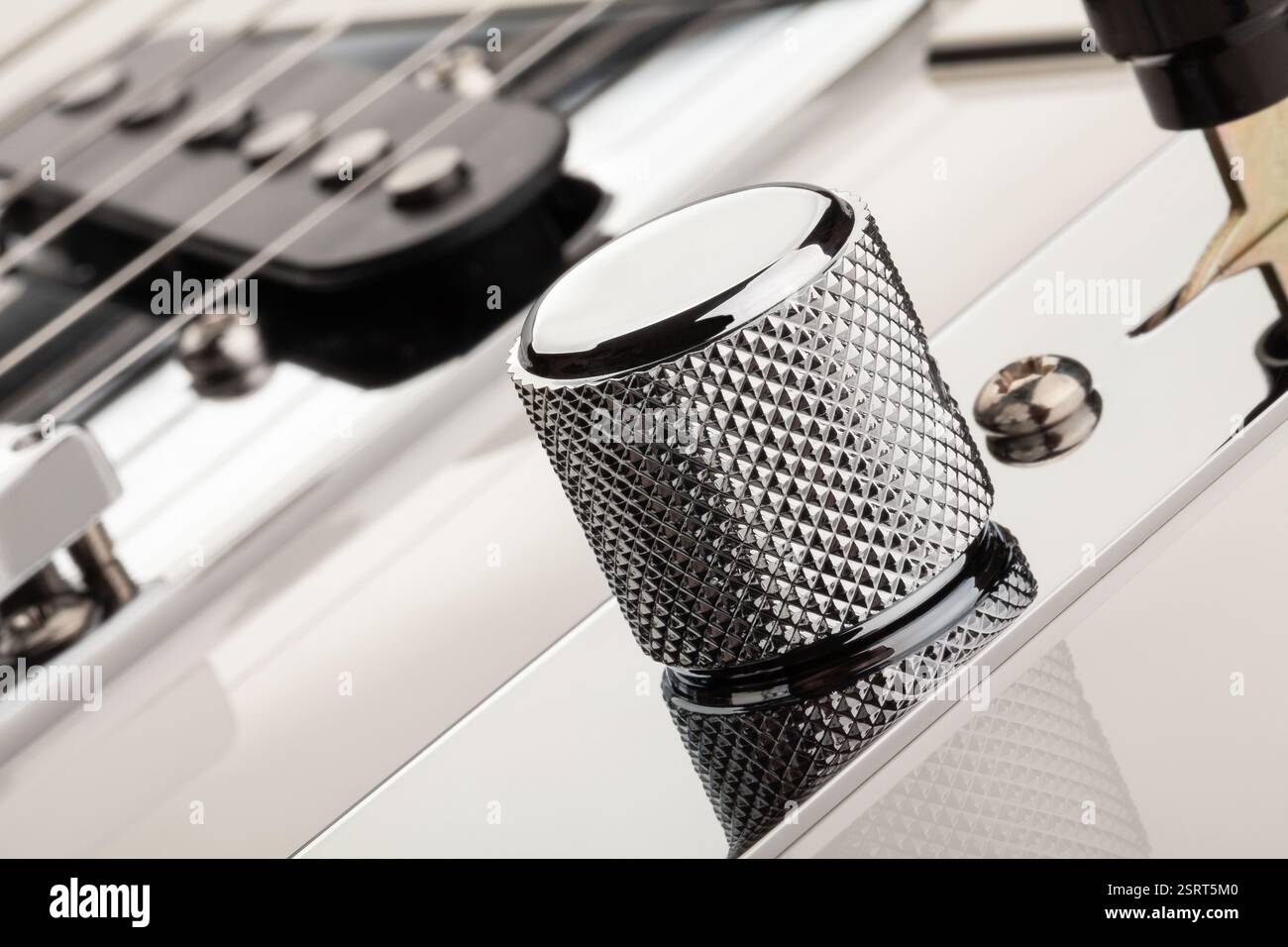 electric guitar volume knob macro cloiseup Stock Photo - Alamy