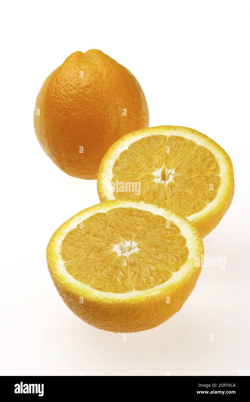 One full orange and two cut pieces citrus reticulata clementin rutaceae ...