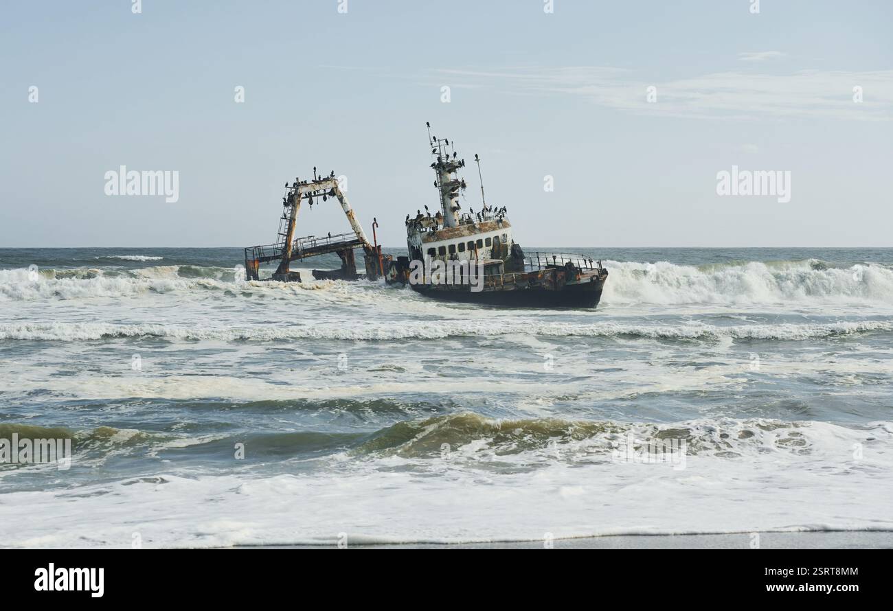 View of abandoned old drowned ship in the sea of Africa Stock Photo - Alamy
