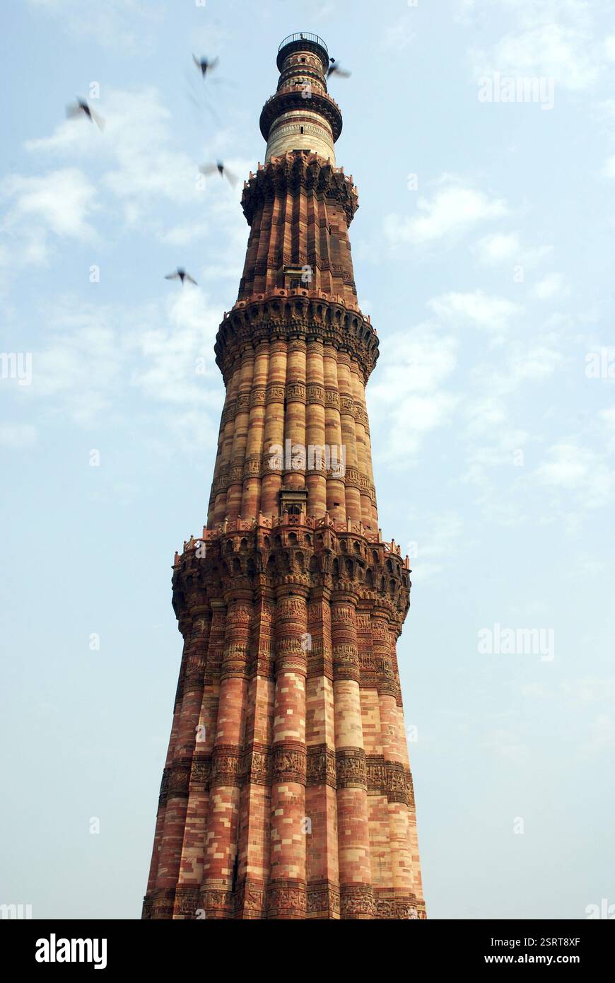 Qutab Kutub Minar against blue sky flying birds, Delhi, India, Asia ...