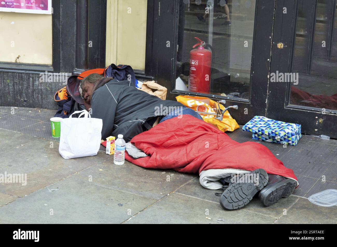 Man sleeping on pavement, Liverpool, England, UK, United Kingdom ...
