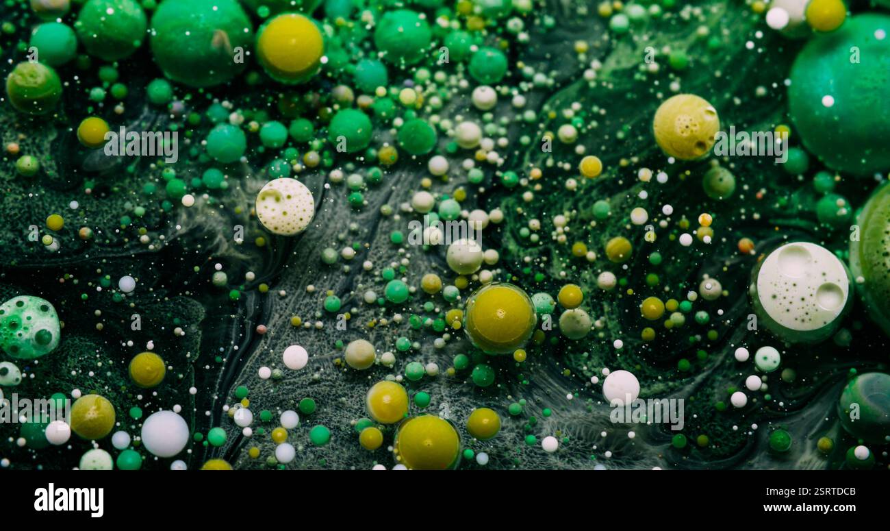 Oil drop paint. Fizzy liquid. Colorful fluid mix bubble bursting. Wave ...
