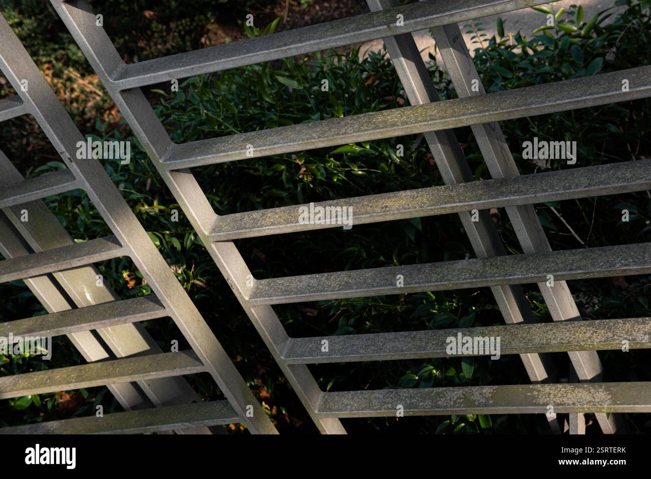 Opened iron metallic gate used as a deterrent to burglars to protect a ...