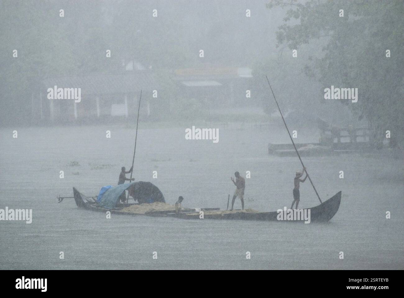Collecting sand during rainy season, Kerala, India, Asia Stock Photo ...